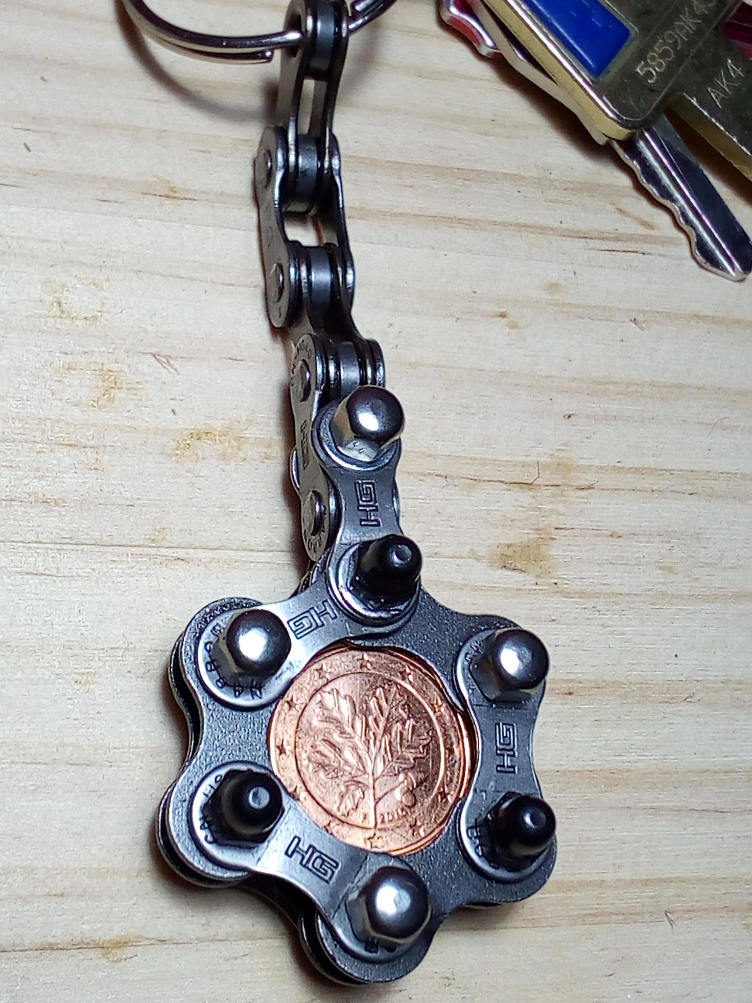 with coins - swisstrailbell® meets bicycle chain art