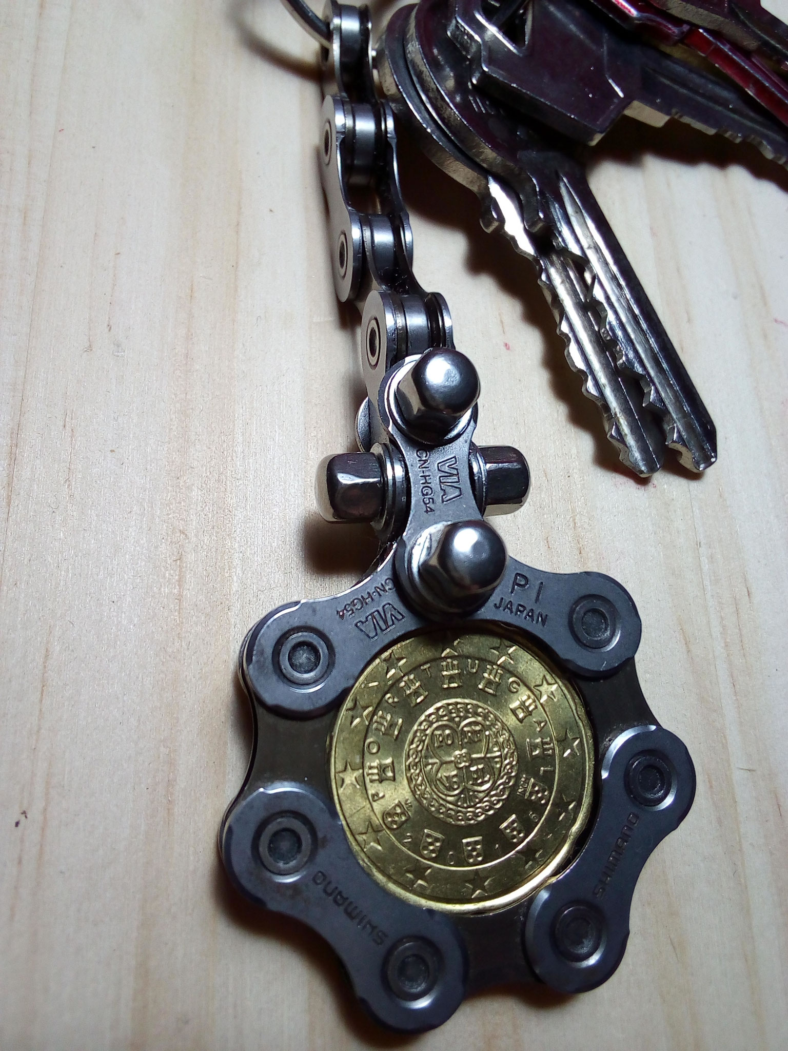 with coins - swisstrailbell® meets bicycle chain art