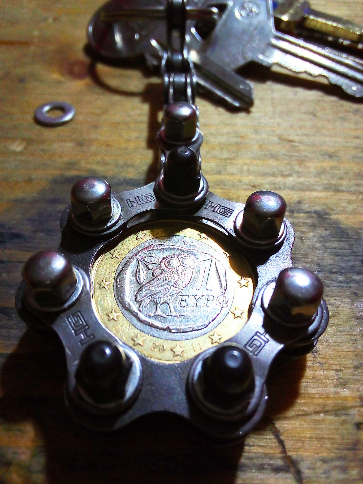 with coins - swisstrailbell® meets bicycle chain art