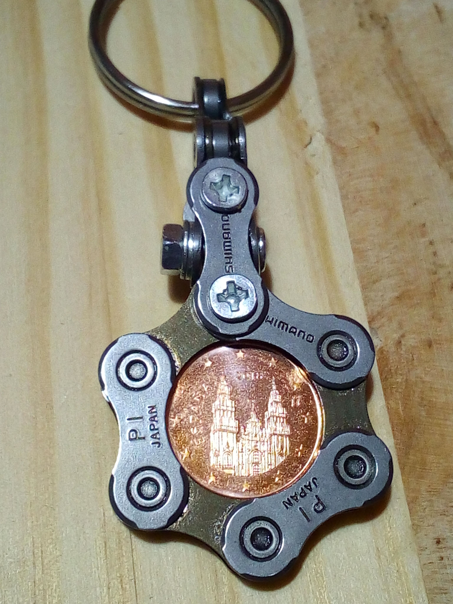 with coins - swisstrailbell® meets bicycle chain art