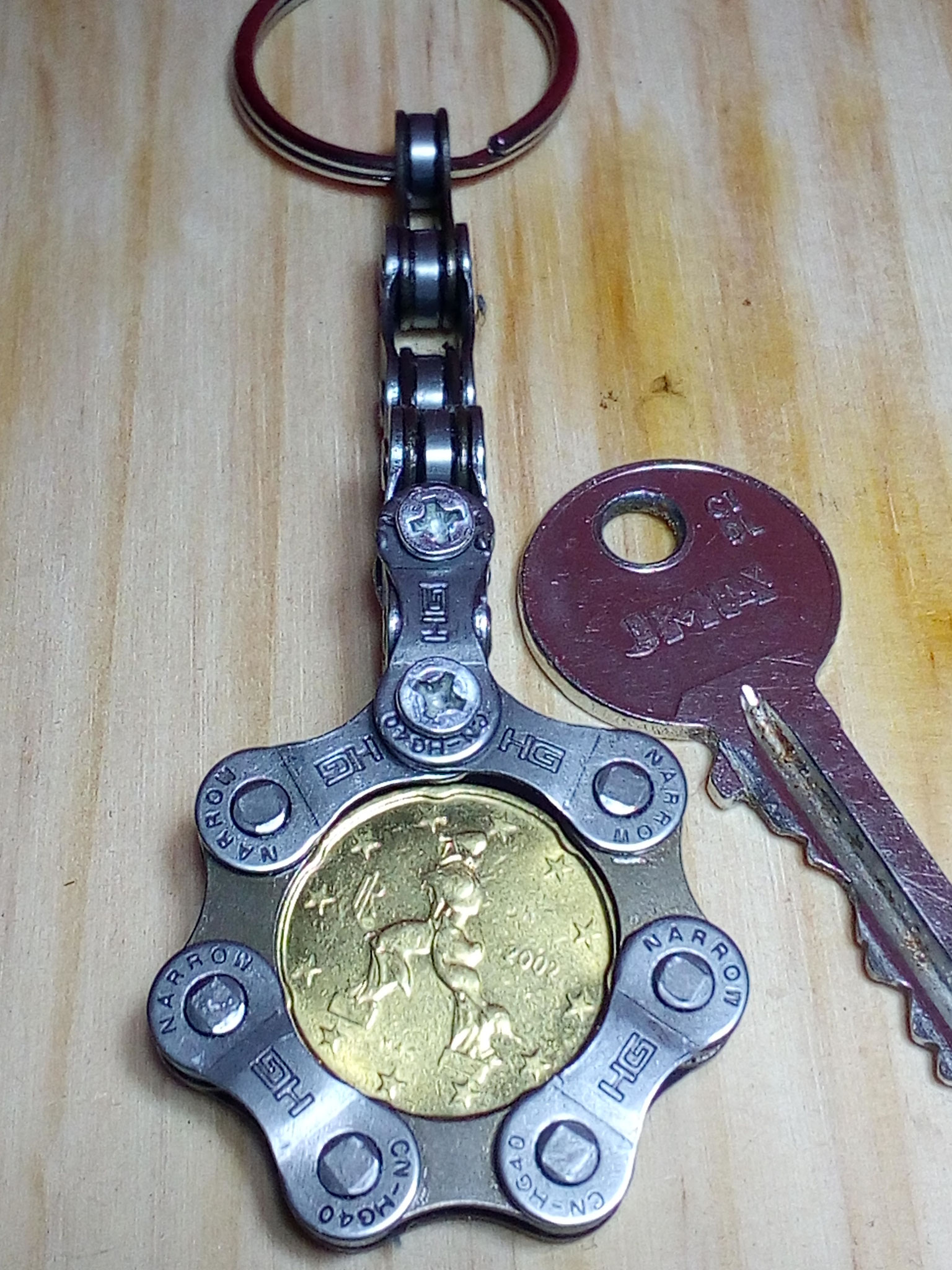 with coins - swisstrailbell® meets bicycle chain art