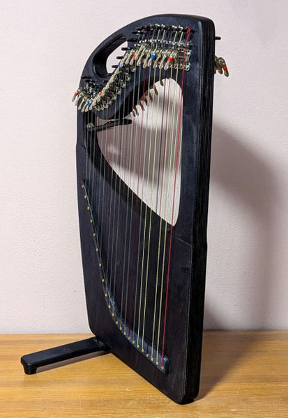 small handheld harp